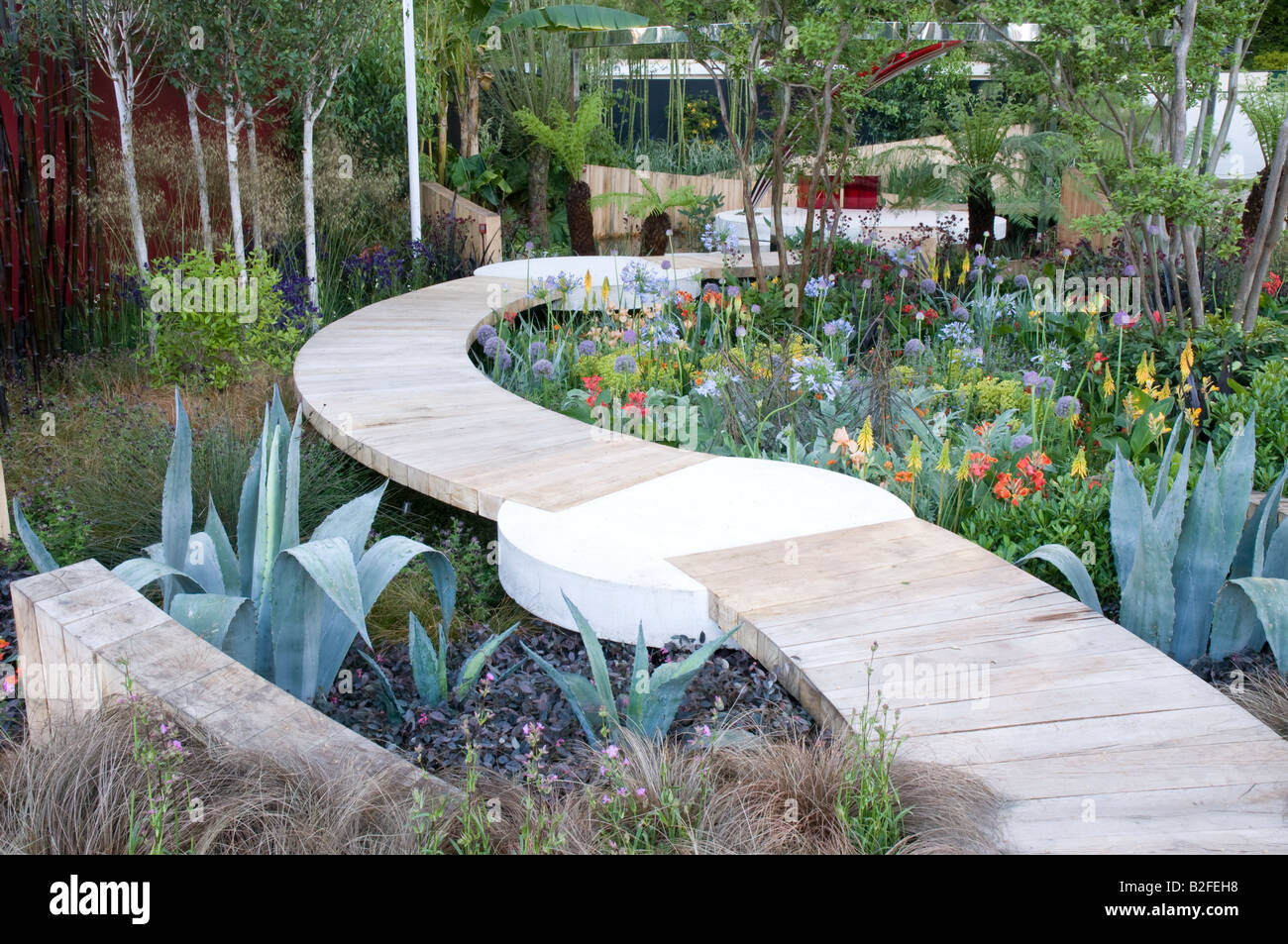 Pathway through flowering plants and textures Stock Photo - Alamy