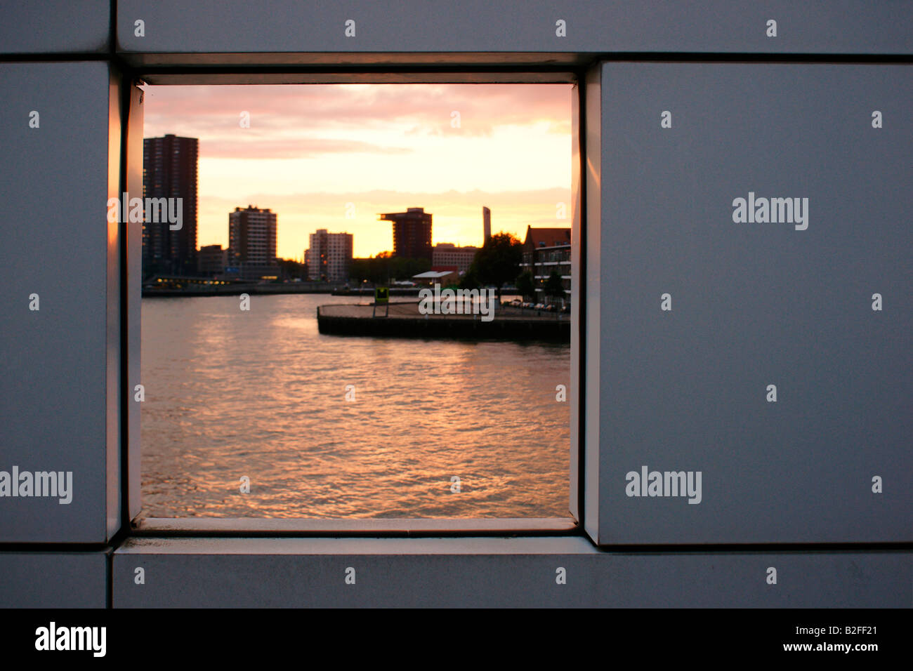 Window hole rectangular opening in steel wall with sunset view of ...