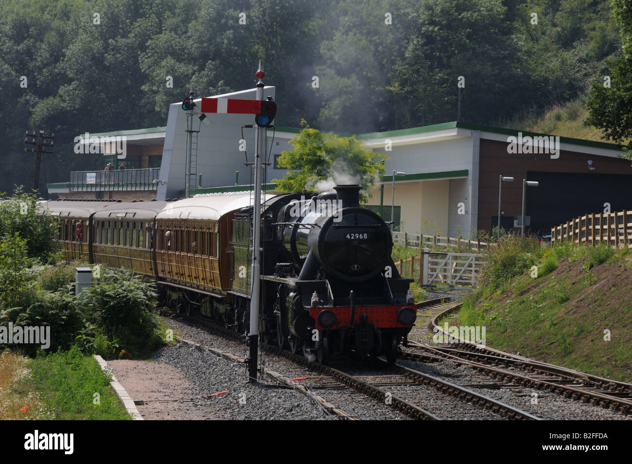 Steam train entering Highley station past the Engine House on the ...