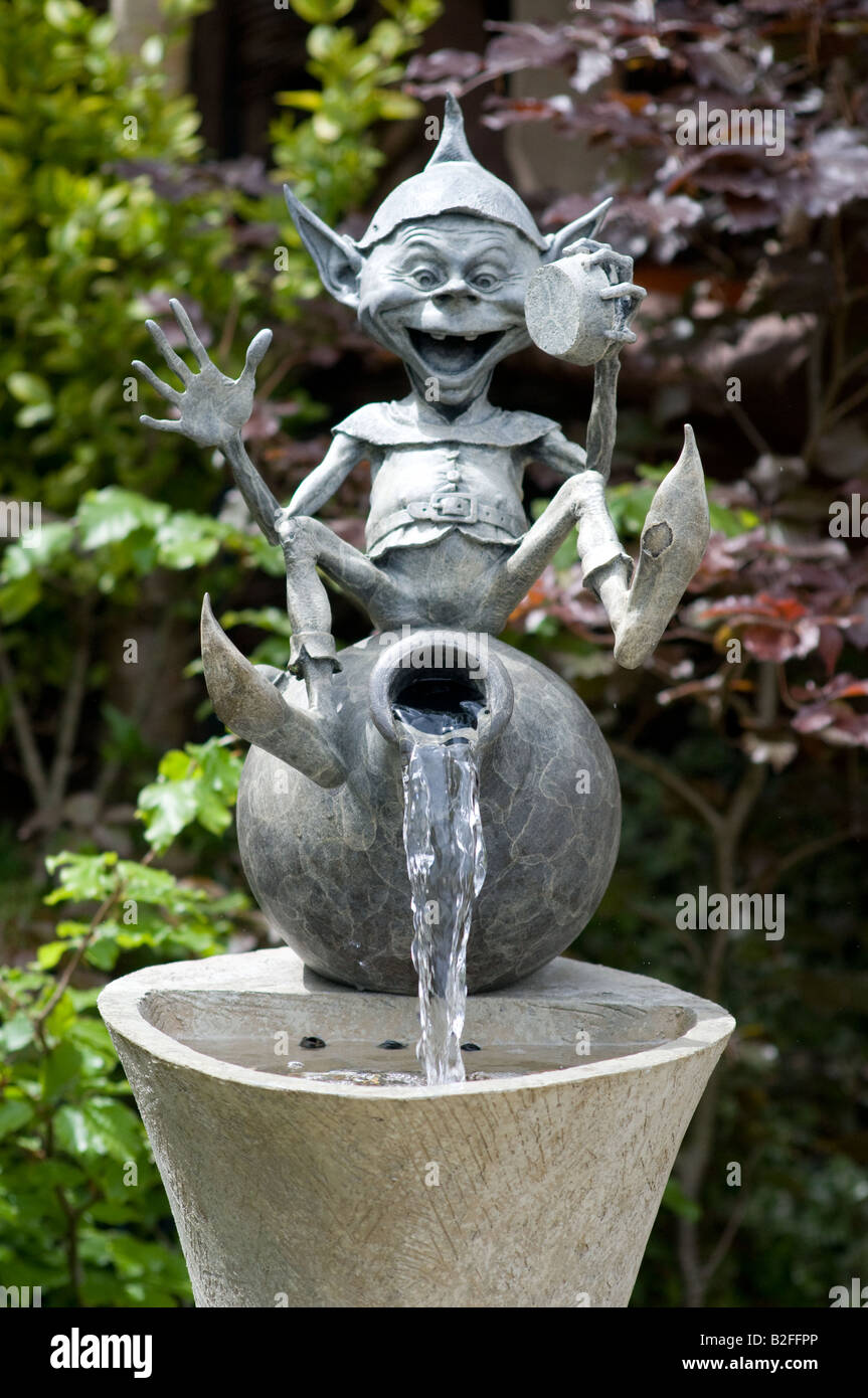 laughing elf water feature garden Stock Photo - Alamy