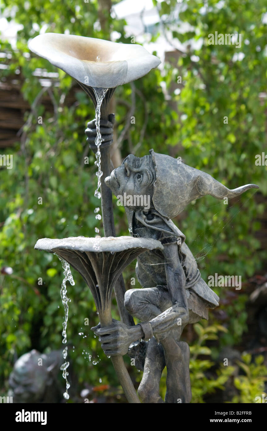 Elf and lily water feature Stock Photo - Alamy