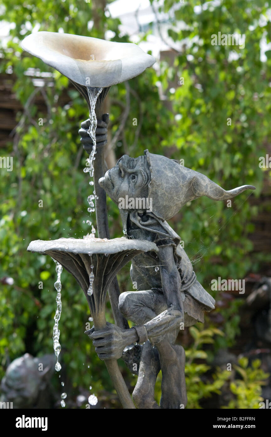 Elf and lily water feature Stock Photo - Alamy
