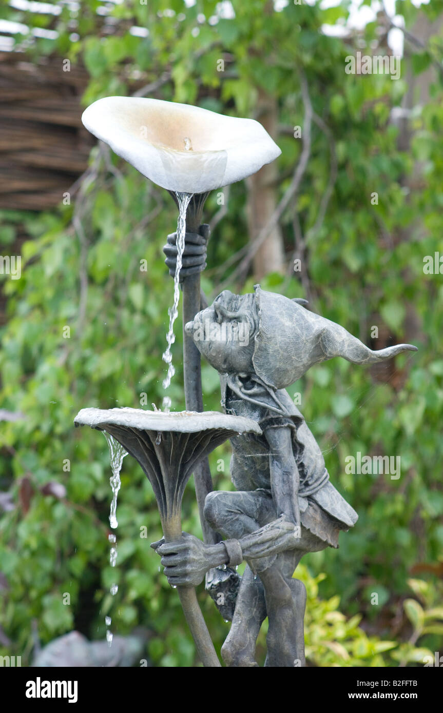 Laughing elf water feature garden Stock Photo - Alamy