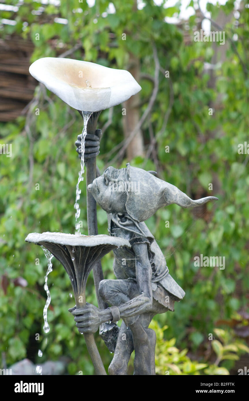 Elf and lily water feature Stock Photo - Alamy