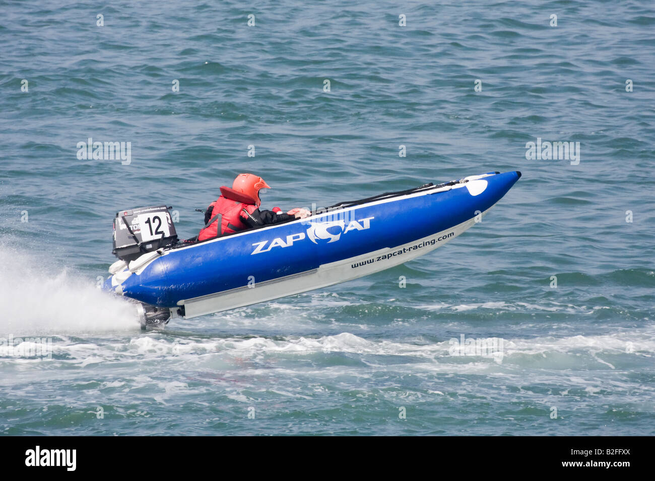 A racing ZapCat inflateable catamaran speedboat airborne from the waves ...
