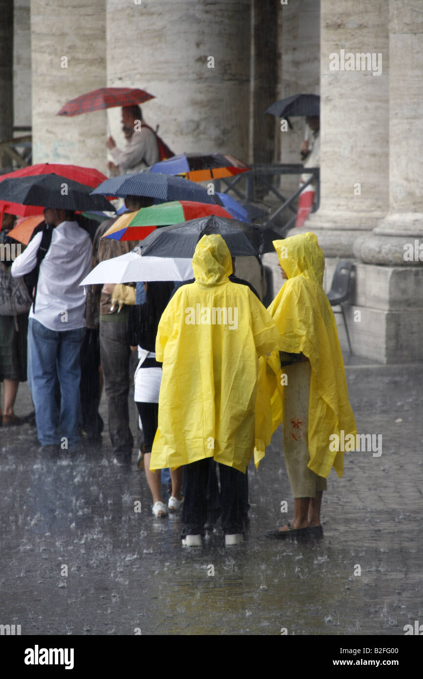 tourists in a queue in heavy rain in vatican, rome Stock Photo - Alamy