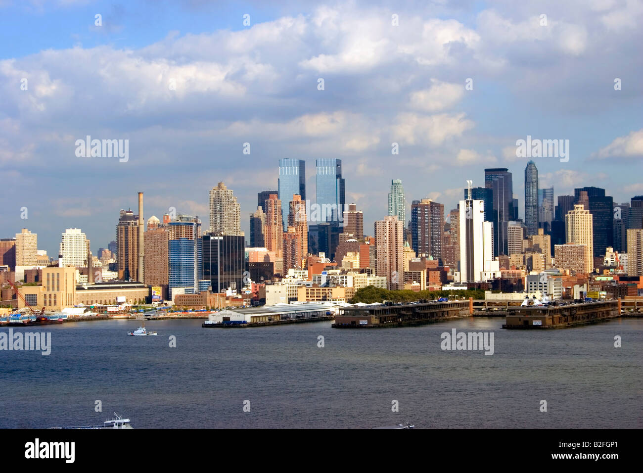 New York City Manhattan day time clouds blue sky kyscrapers lighted ...