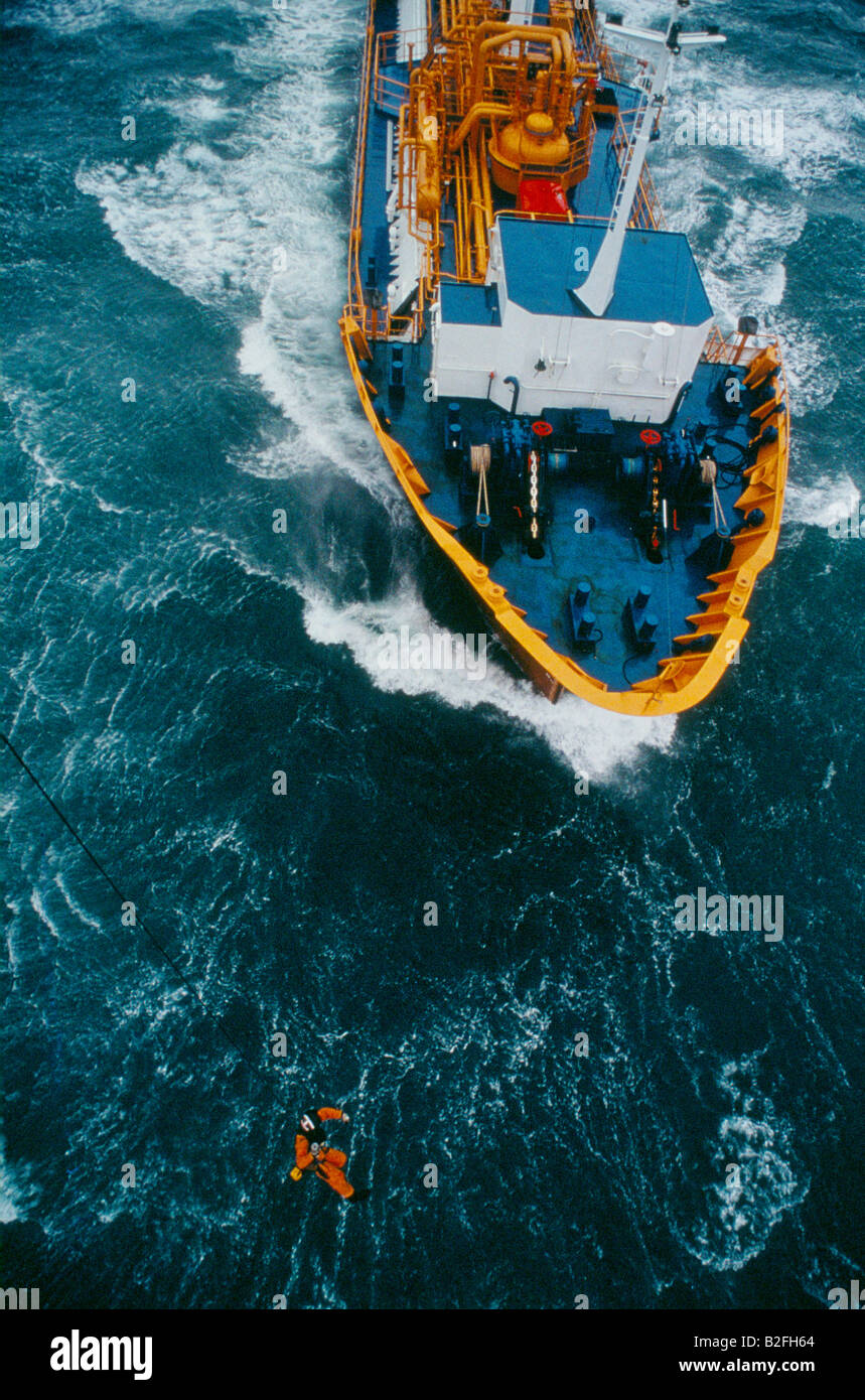 air sea rescue sea king helicopter deck exercise winchman being lowered ...