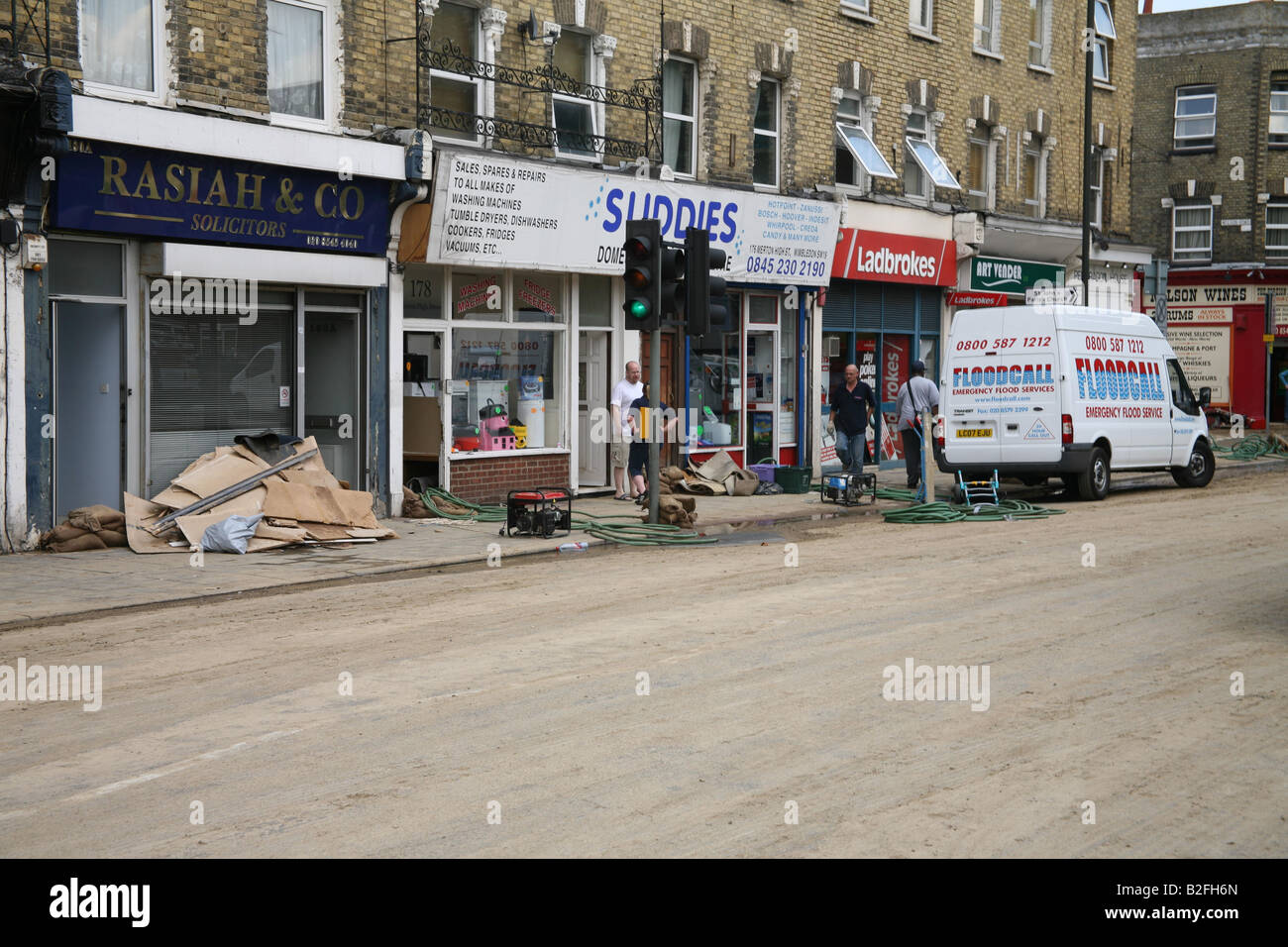 Merton High Street closed after a burst water main Stock Photo - Alamy