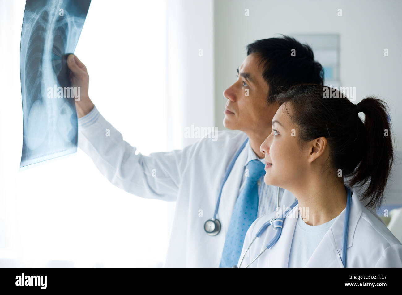 Examining facial hi-res stock photography and images - Alamy