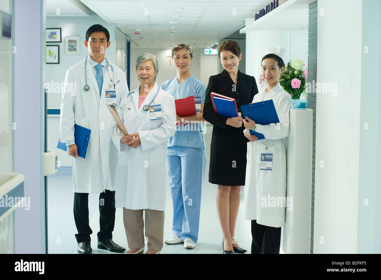 Portrait of medical staff standing in a corridor Stock Photo - Alamy