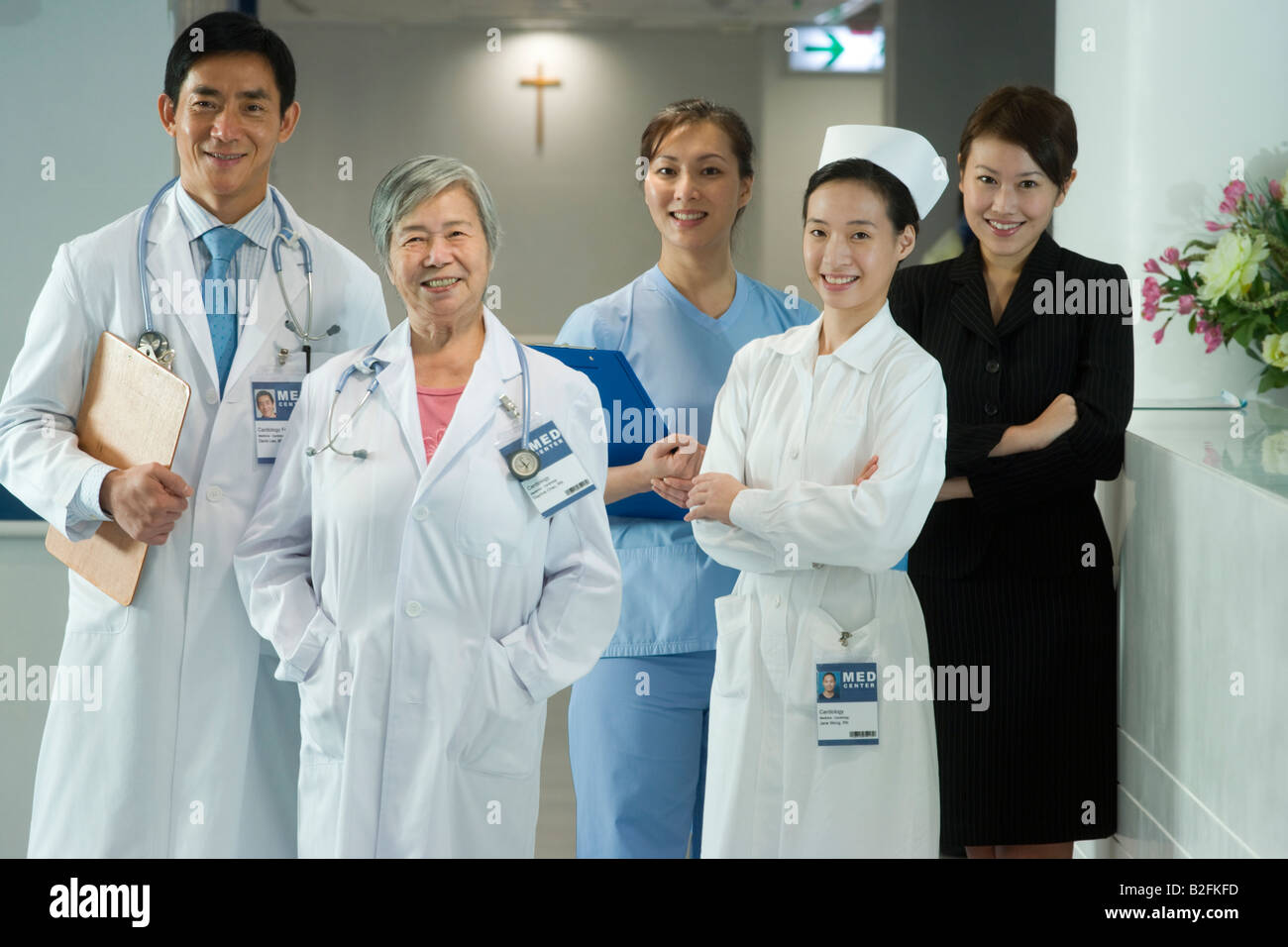 Portrait of medical staff standing in a corridor and smiling Stock ...