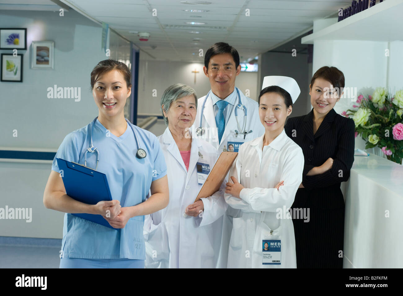 Portrait of medical staff standing in a corridor and smiling Stock ...