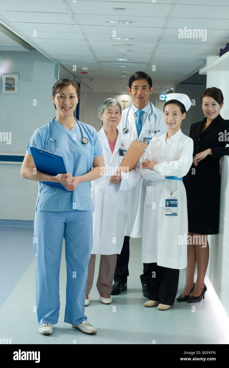 Portrait of medical staff standing in a corridor and smiling Stock ...