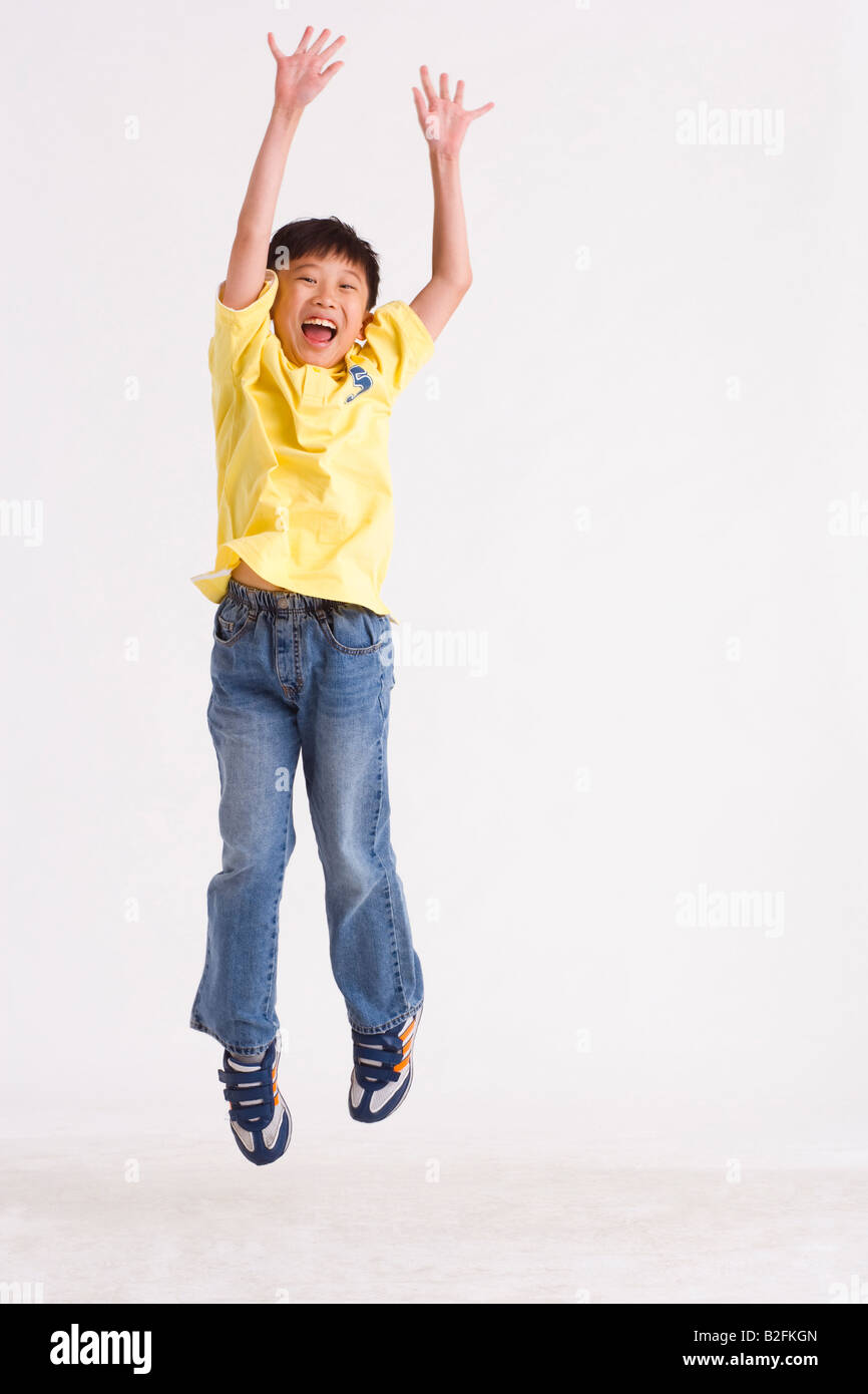 Portrait of a boy jumping Stock Photo - Alamy