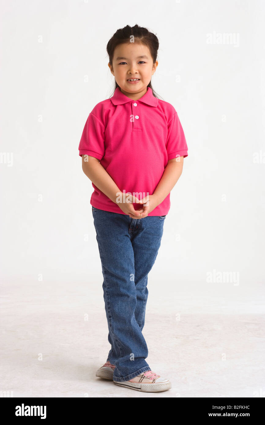 Portrait of a girl standing and smiling Stock Photo - Alamy