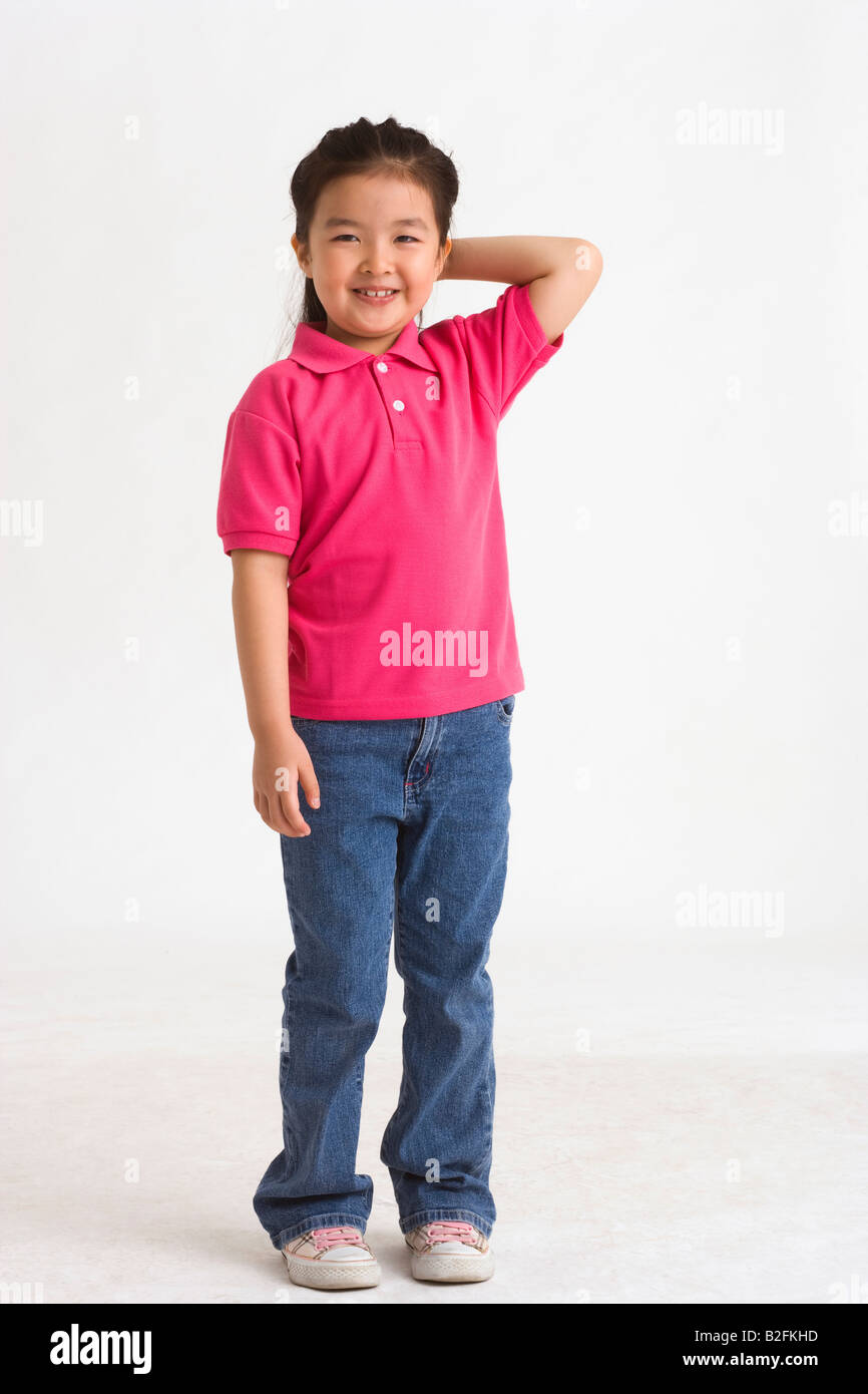 Portrait of a girl standing and smiling Stock Photo - Alamy