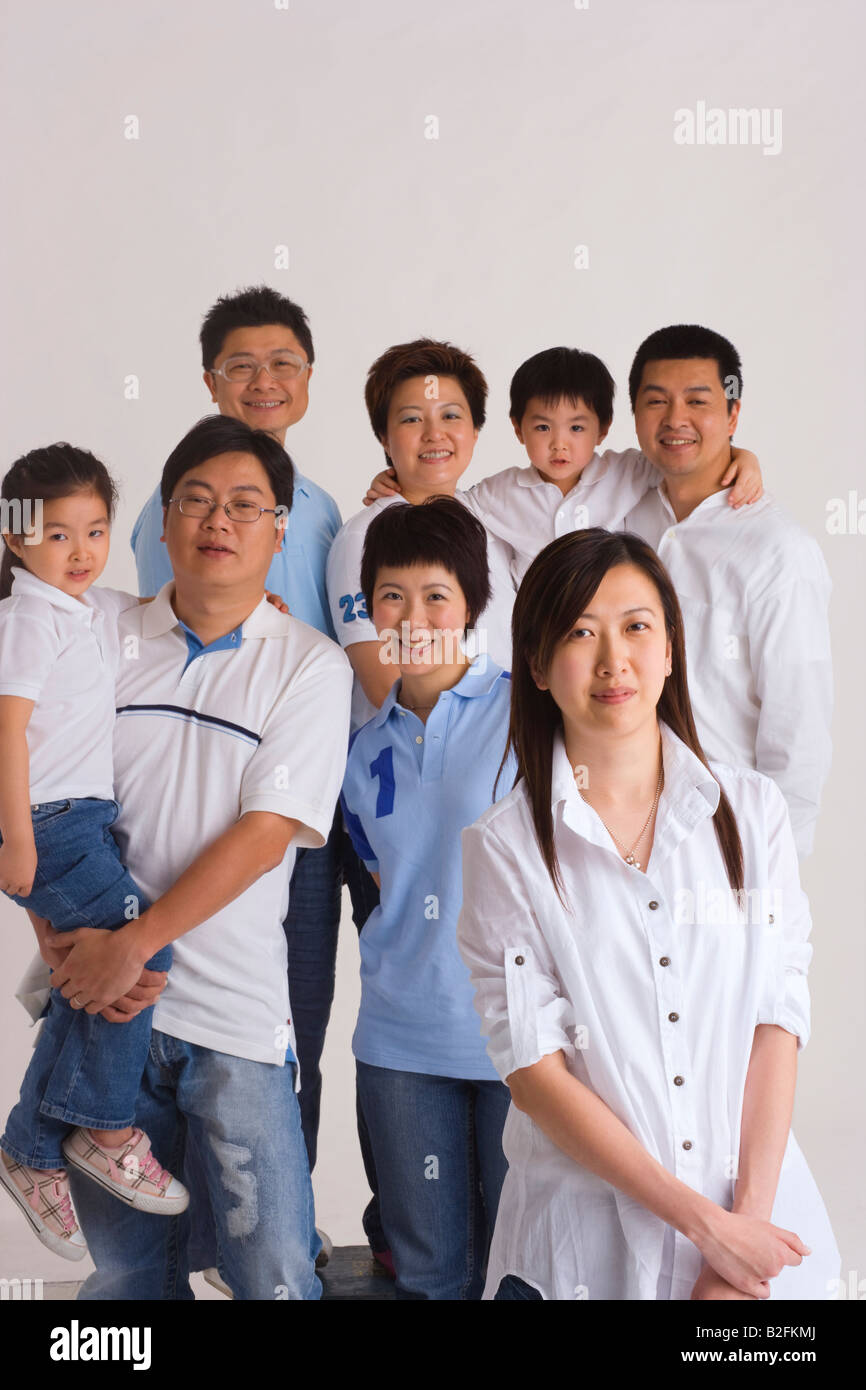 Portrait of three mid adult couples with their children Stock Photo - Alamy