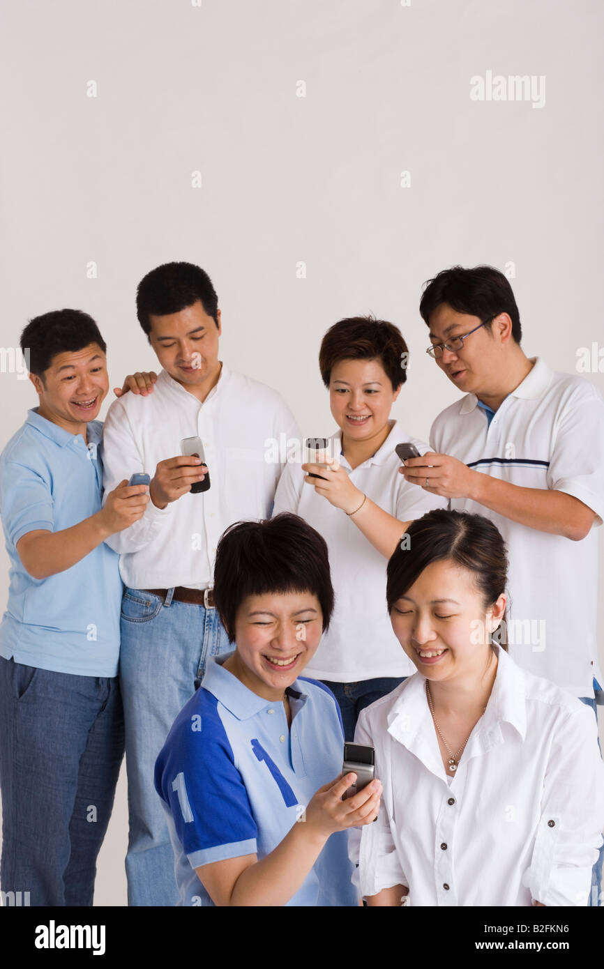Group of people using mobile phones Stock Photo - Alamy