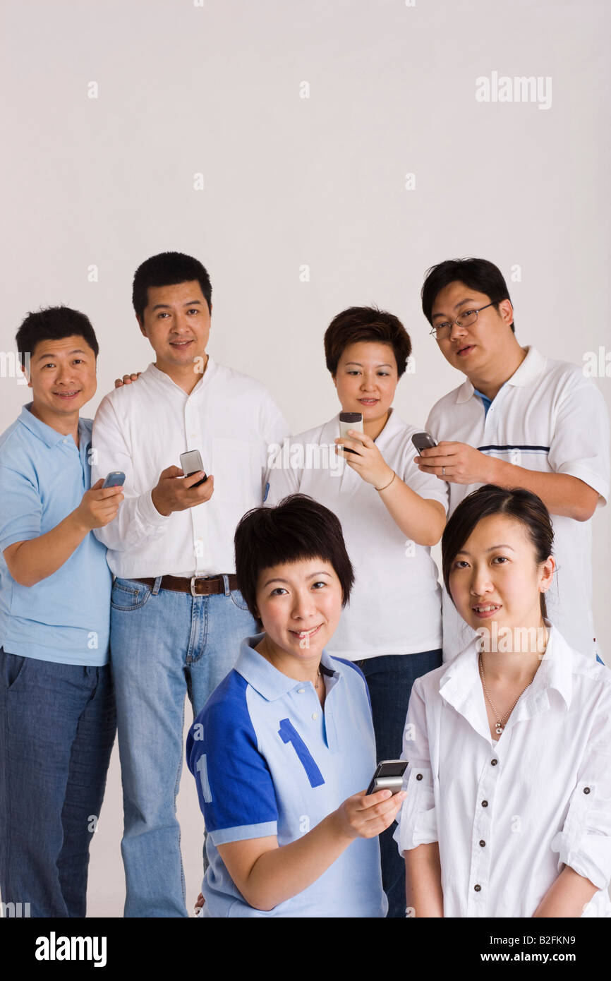 Group of people using mobile phones Stock Photo - Alamy