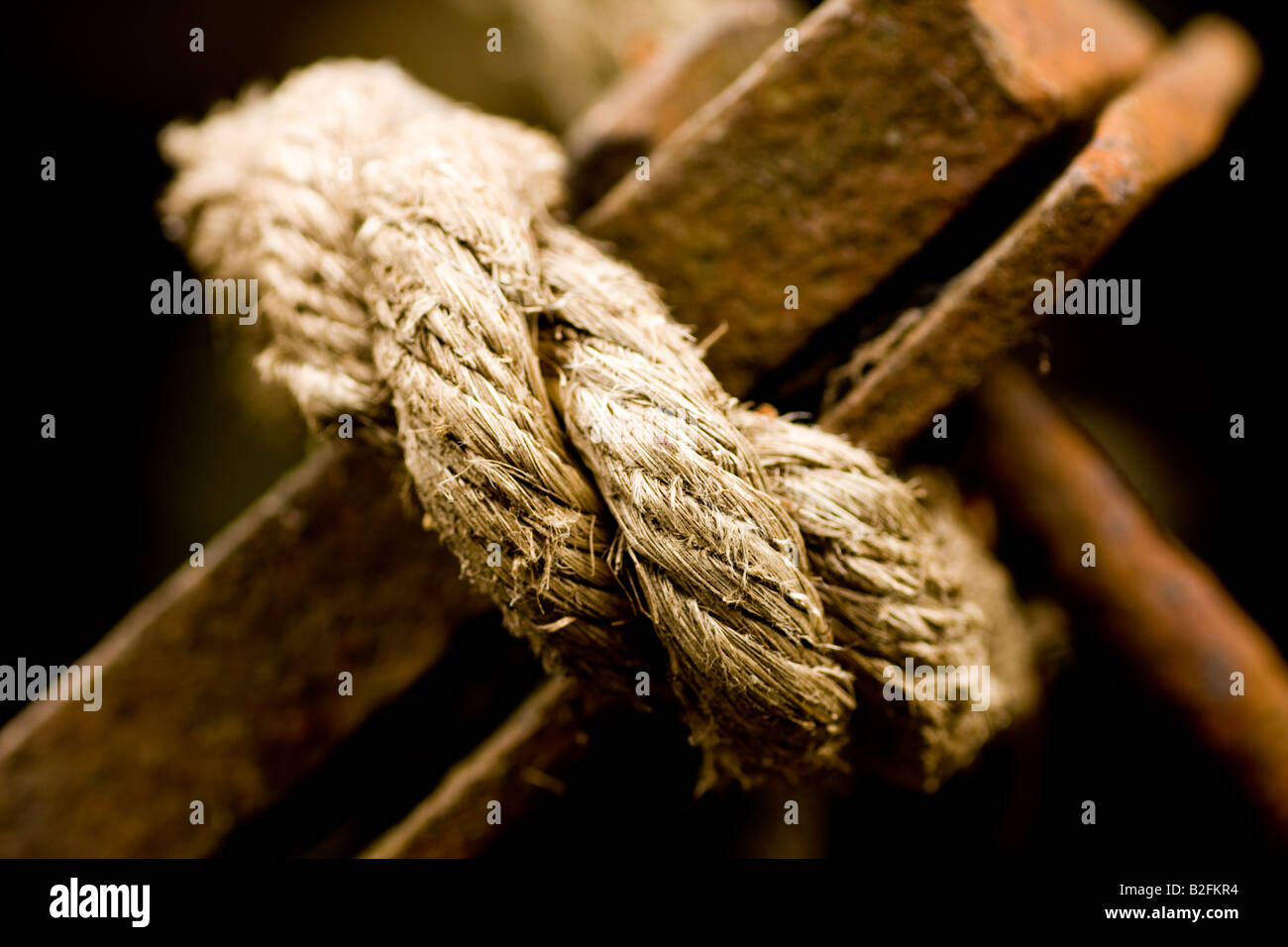 Rope Wrapped Around Piece of Rusty Metal Stock Photo - Alamy