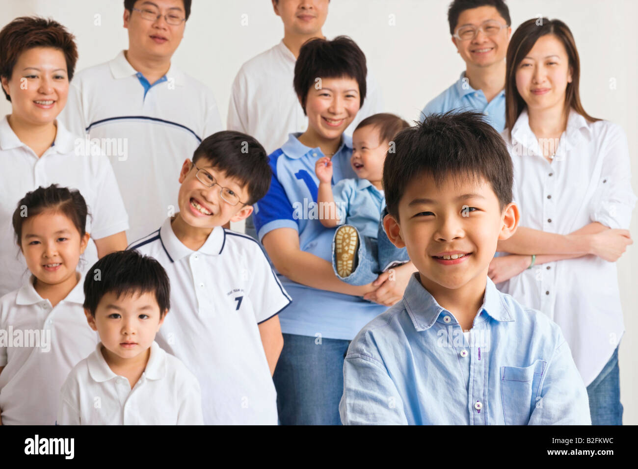 Portrait of three mid adult couples with their children Stock Photo - Alamy