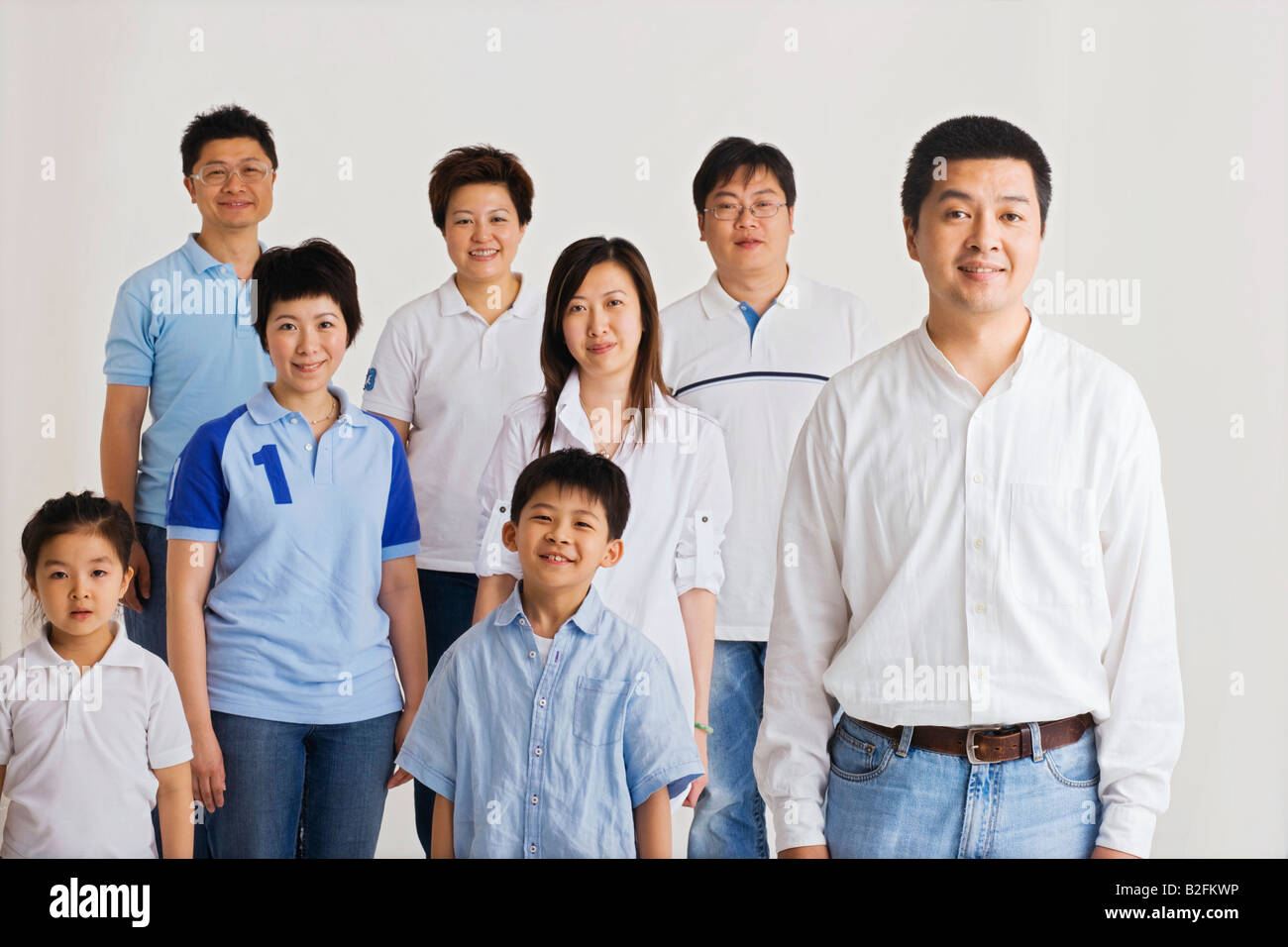 Portrait of three mid adult couples with their children Stock Photo - Alamy