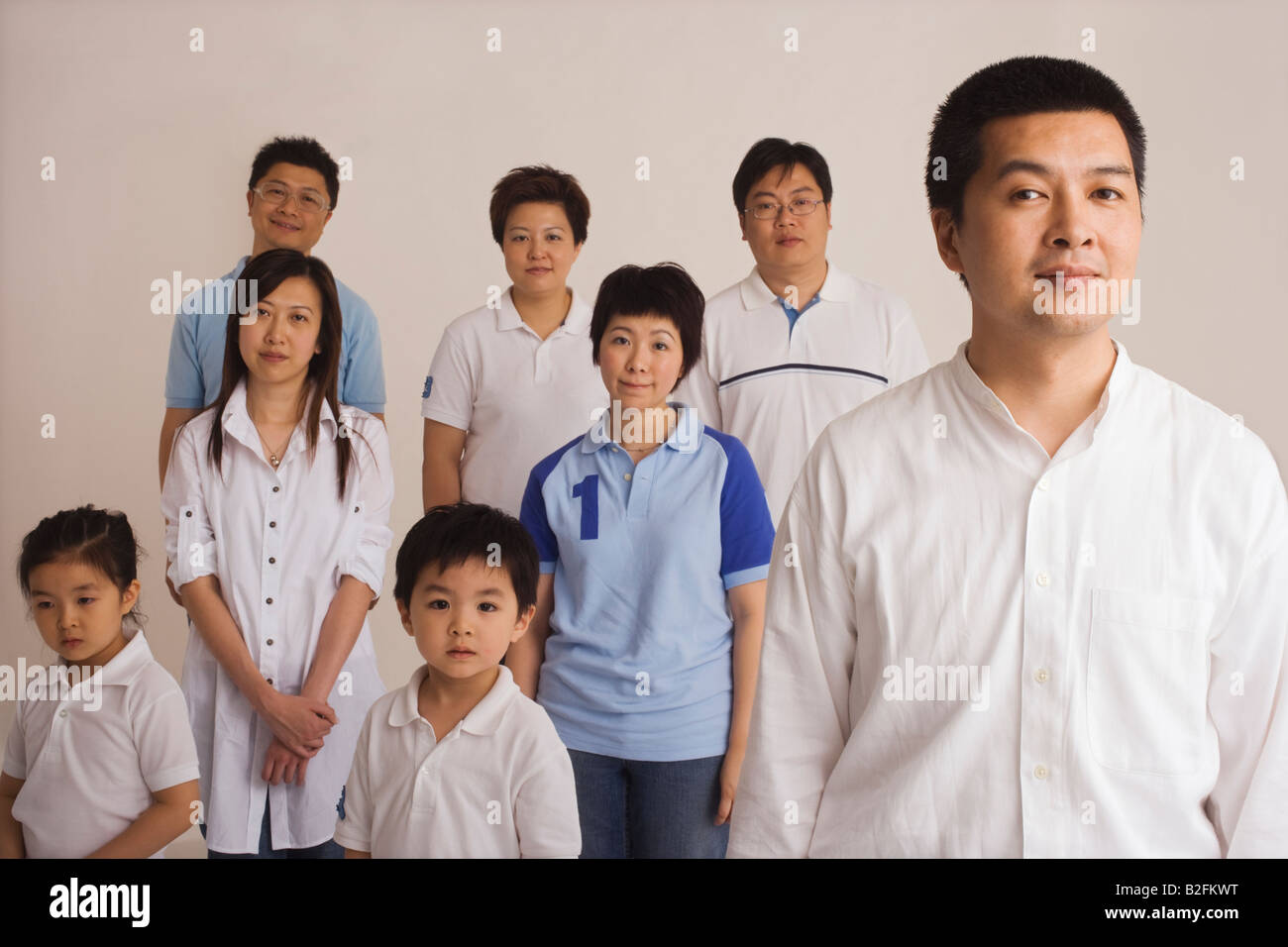 Portrait of three mid adult couples with their children Stock Photo - Alamy