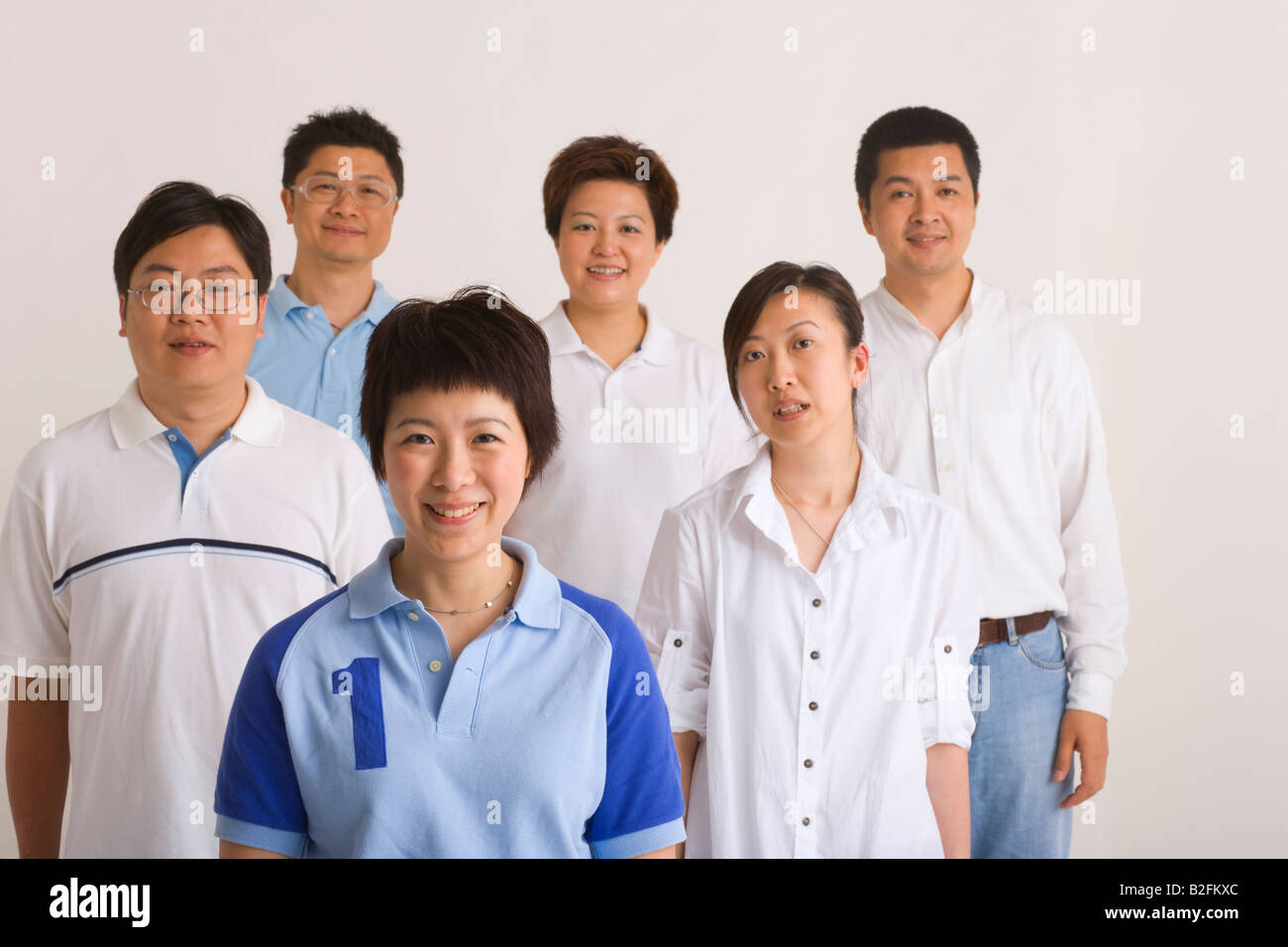 Portrait of three mid adult couples standing together Stock Photo - Alamy