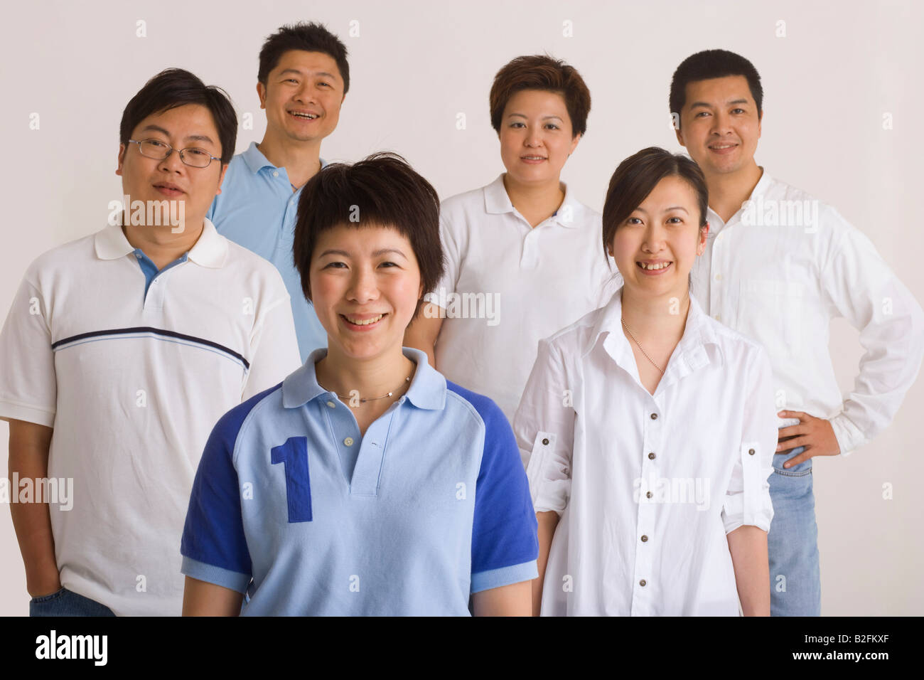 Portrait of three mid adult couples standing together Stock Photo - Alamy