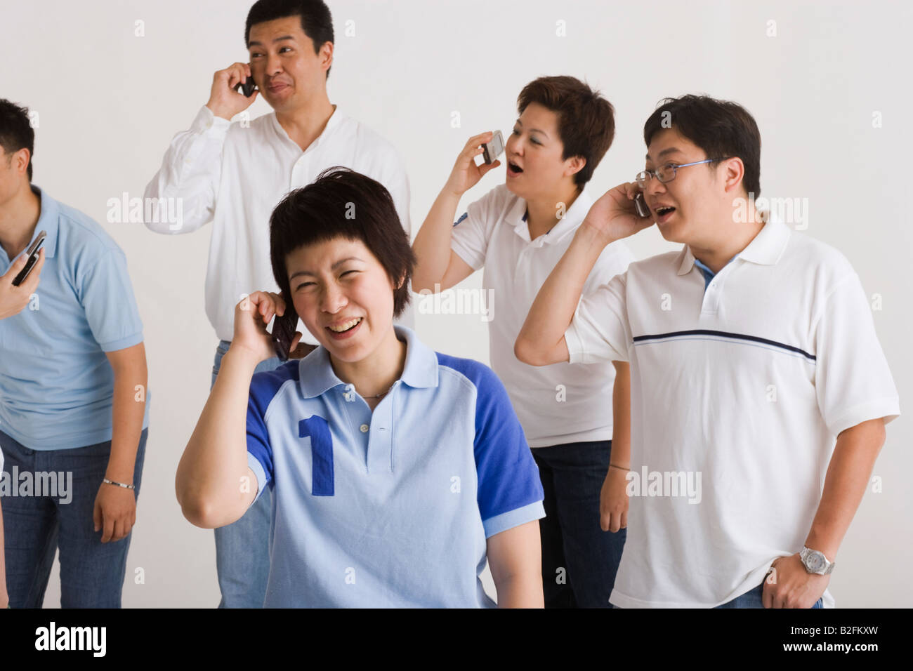 Five people talking on mobile phones Stock Photo - Alamy