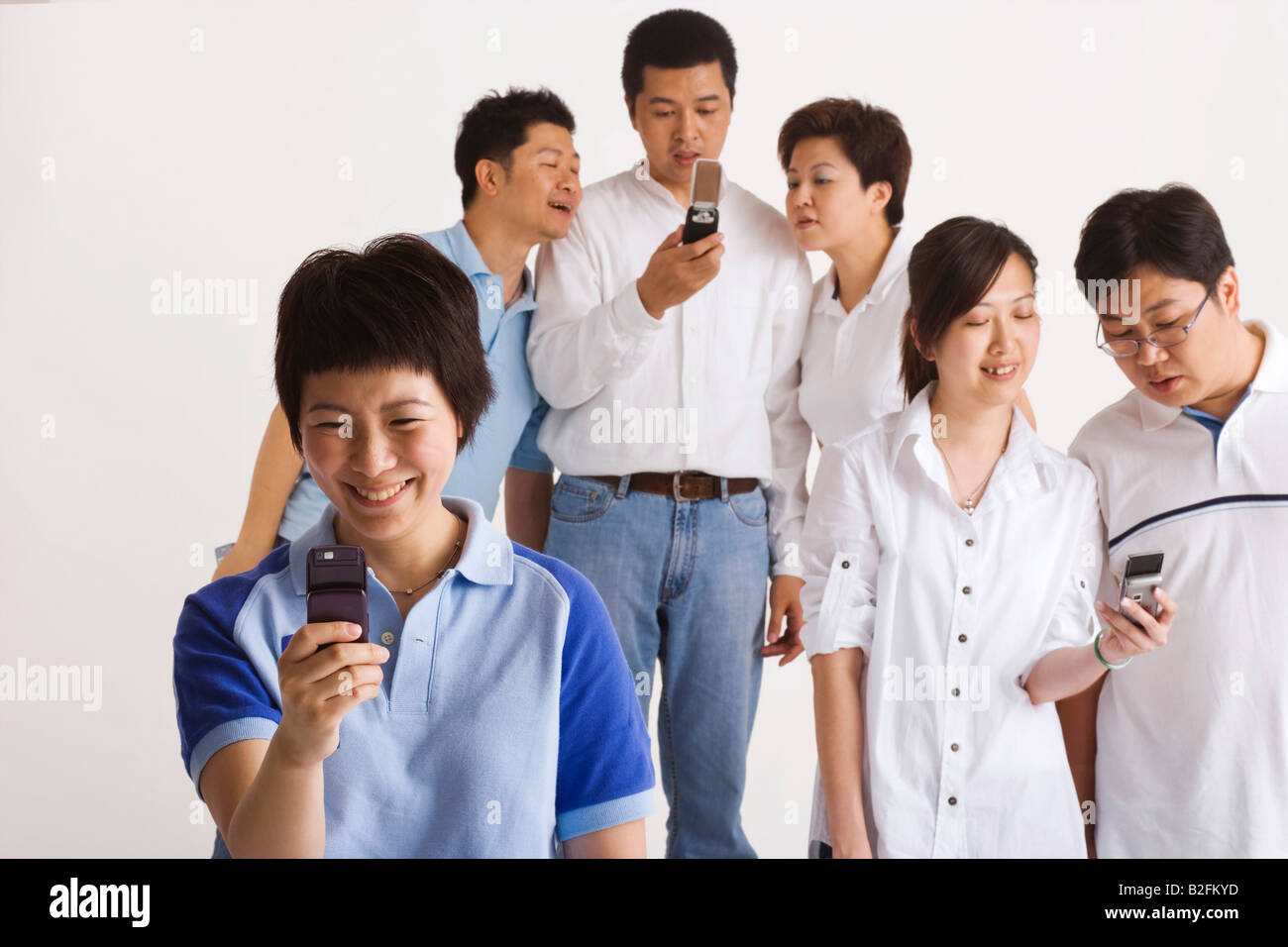Group of people using mobile phones Stock Photo - Alamy