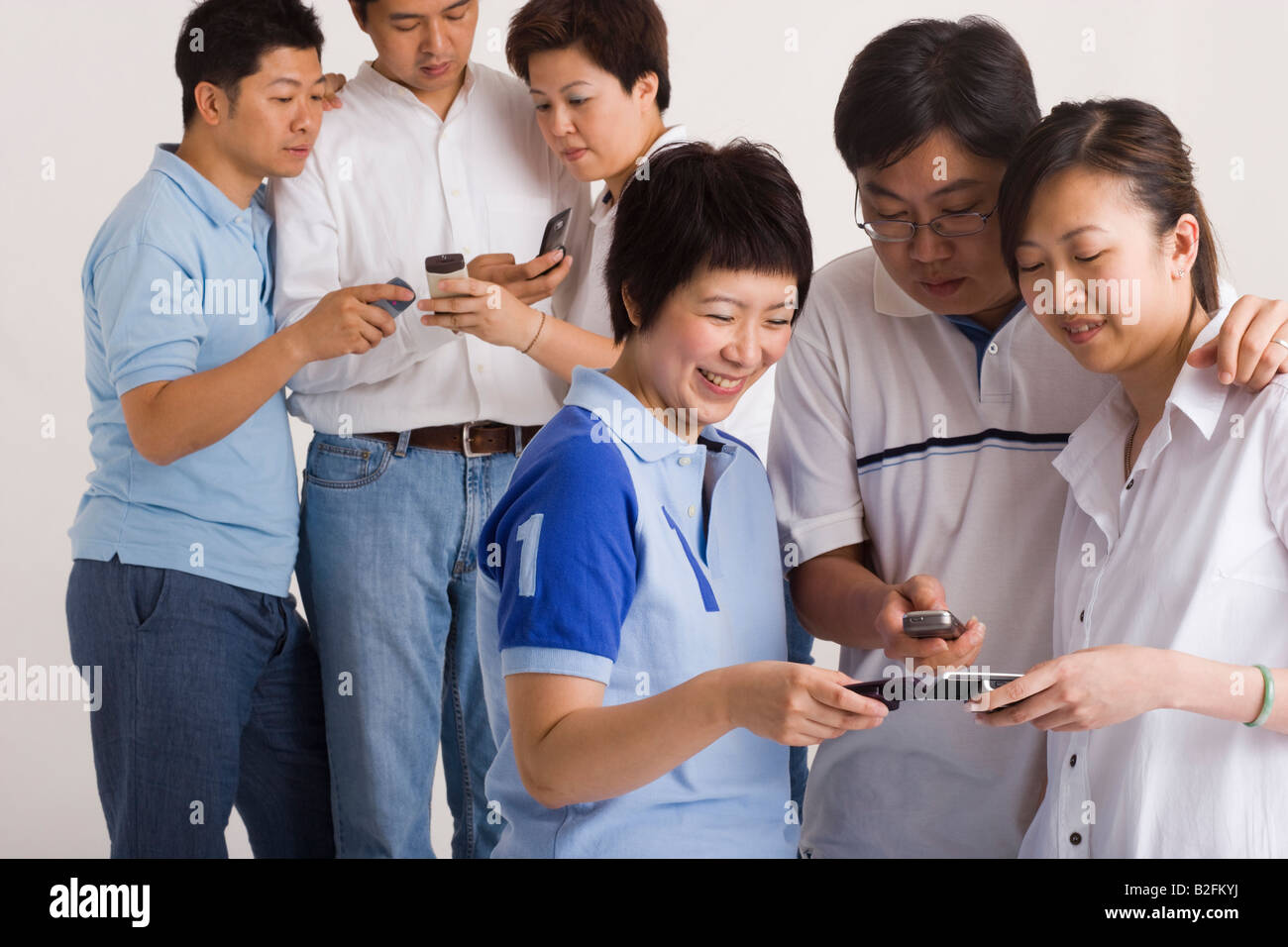 Group of people using mobile phones Stock Photo - Alamy