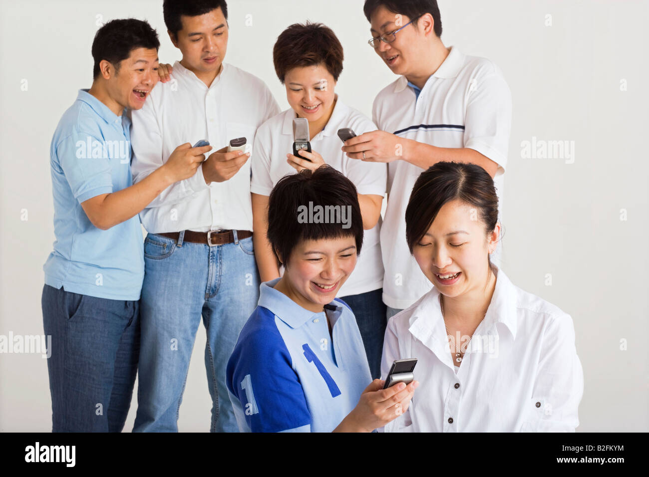 Group of people using mobile phones Stock Photo - Alamy