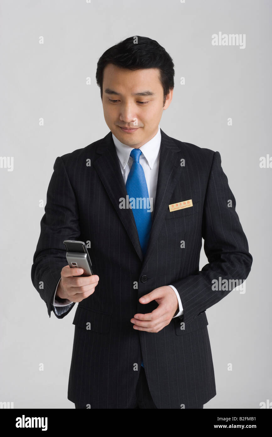 Businessman text messaging Stock Photo - Alamy