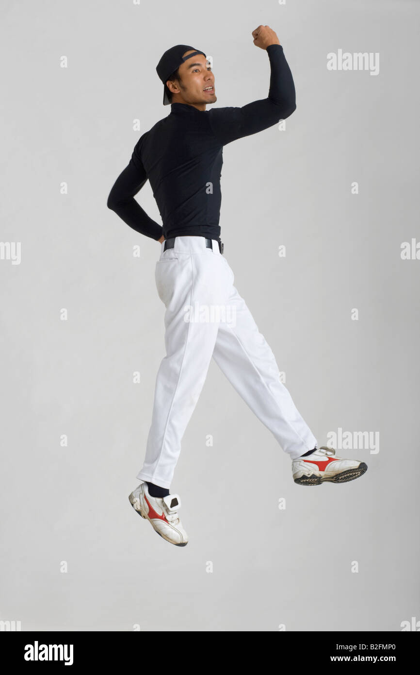 Side profile of a young man jumping Stock Photo - Alamy