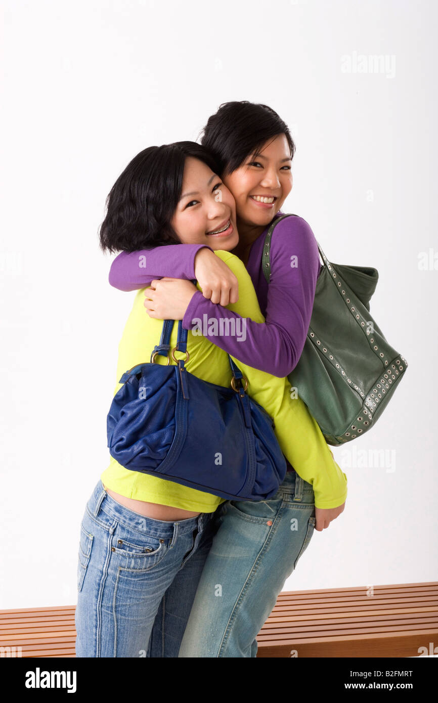 Two black women hugging each other hi-res stock photography and images ...
