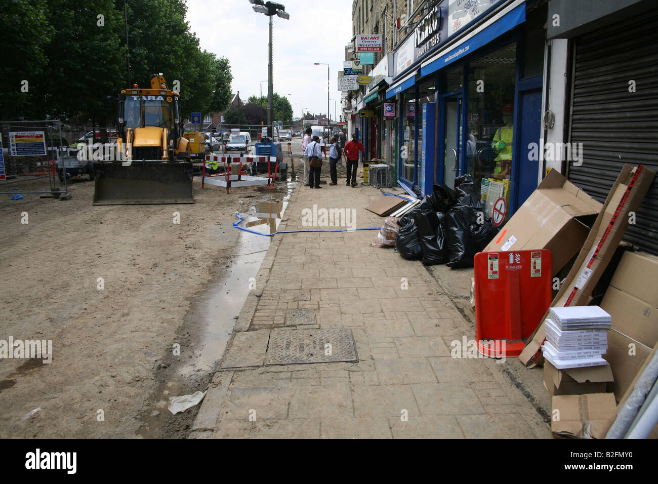 Merton High Street closed after a burst water main Stock Photo - Alamy