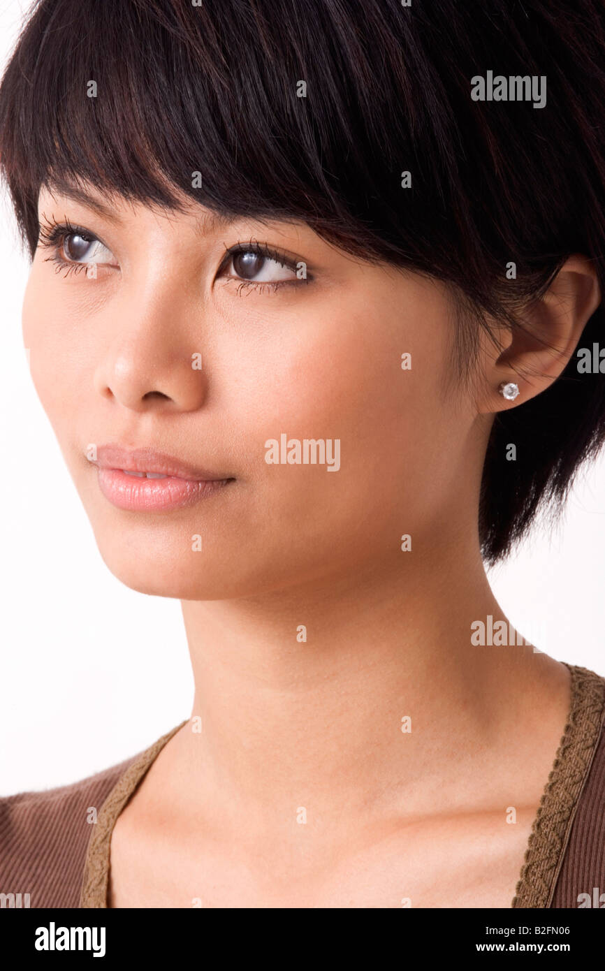 Close-up of a young woman thinking Stock Photo - Alamy