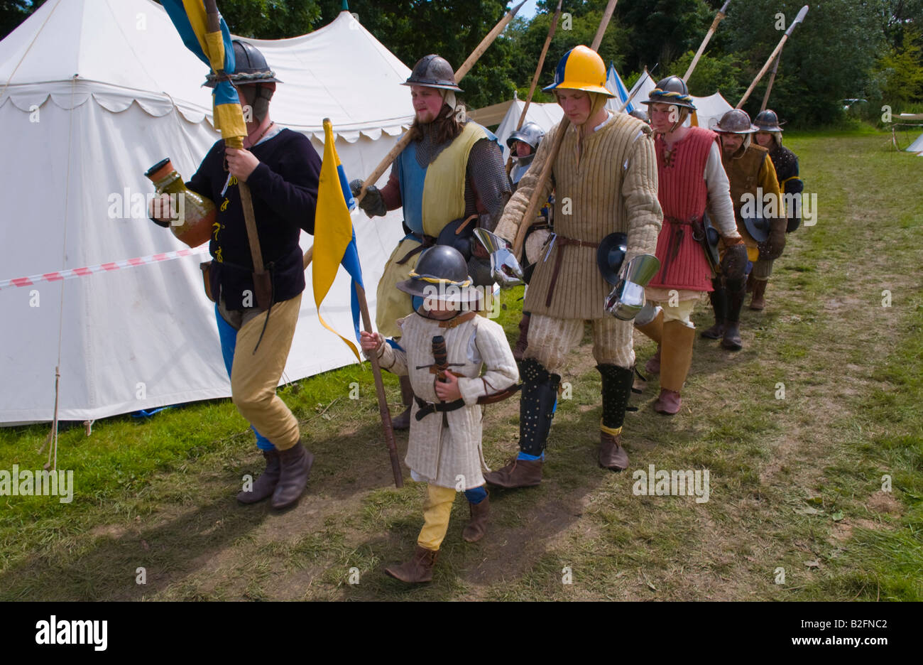 Column of medieval soldiers march at Tewkesbury Medieval Festival ...