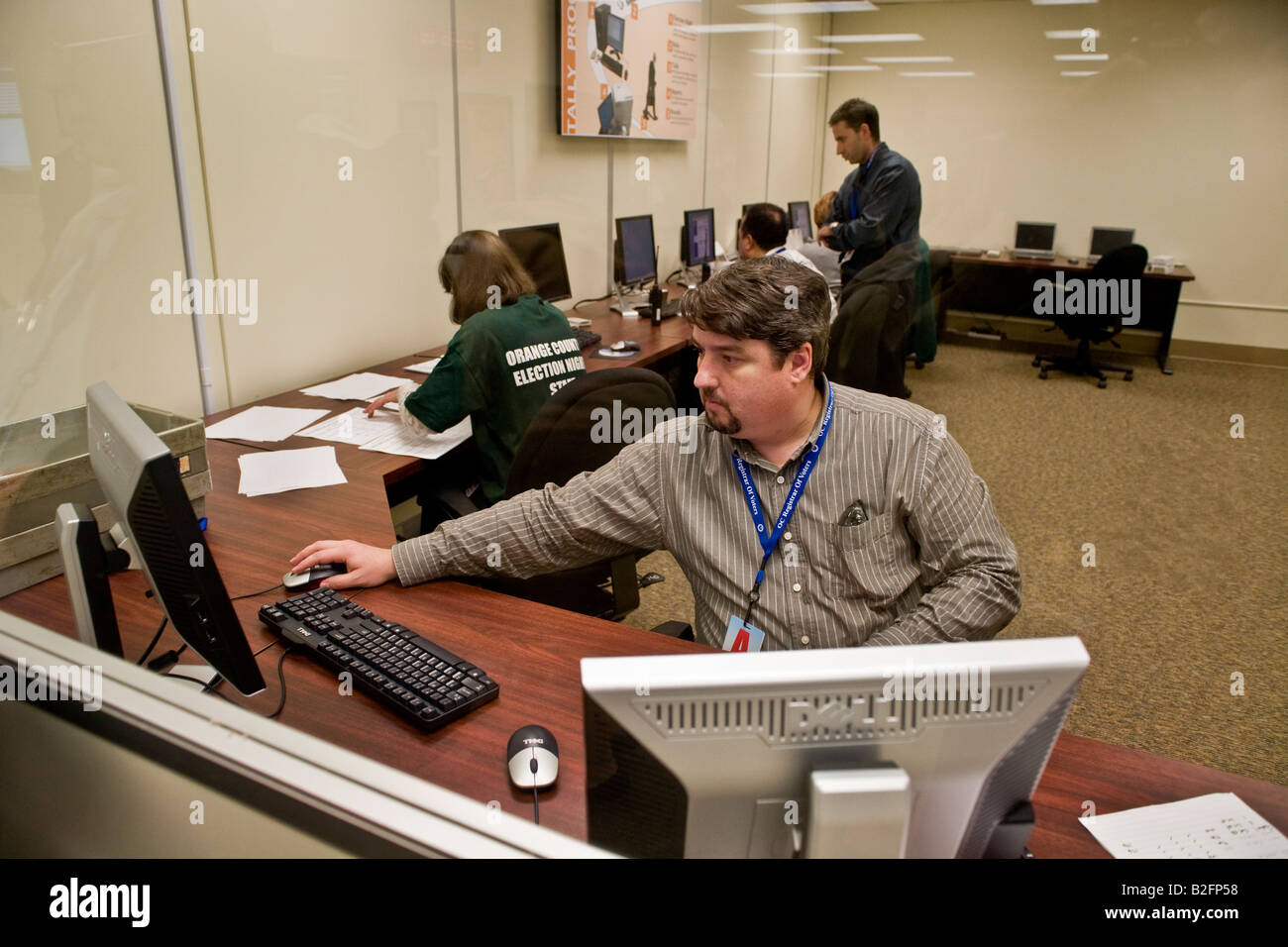 On election night ballots are tabulated in a secure room at the Orange ...