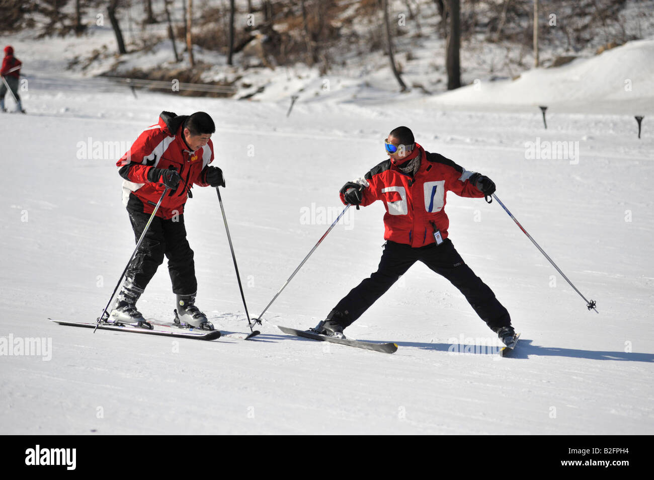 Novice Chinese skier learning from an instructor at Yabuli Ski Resort ...