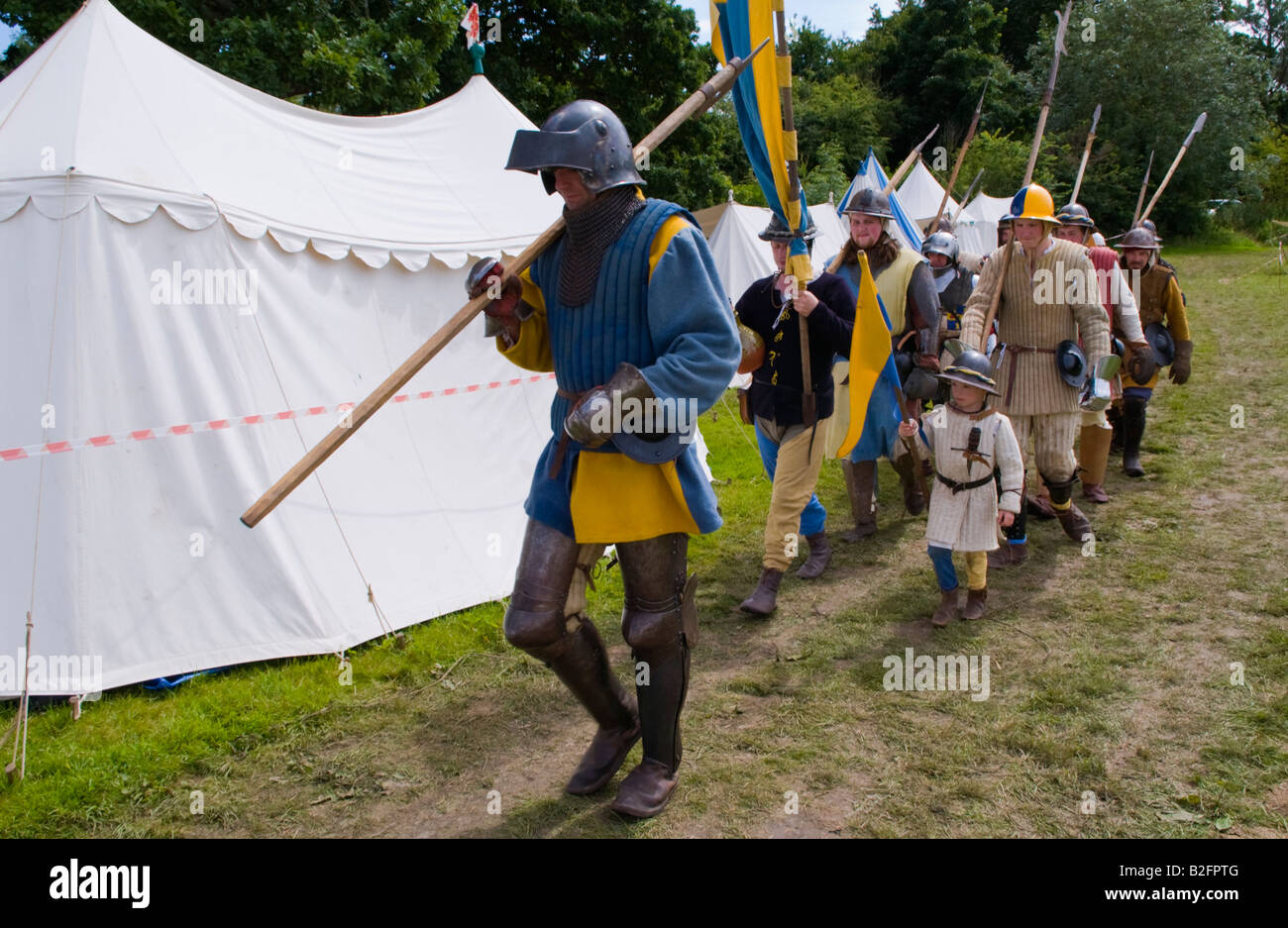 Column of medieval soldiers march at Tewkesbury Medieval Festival ...