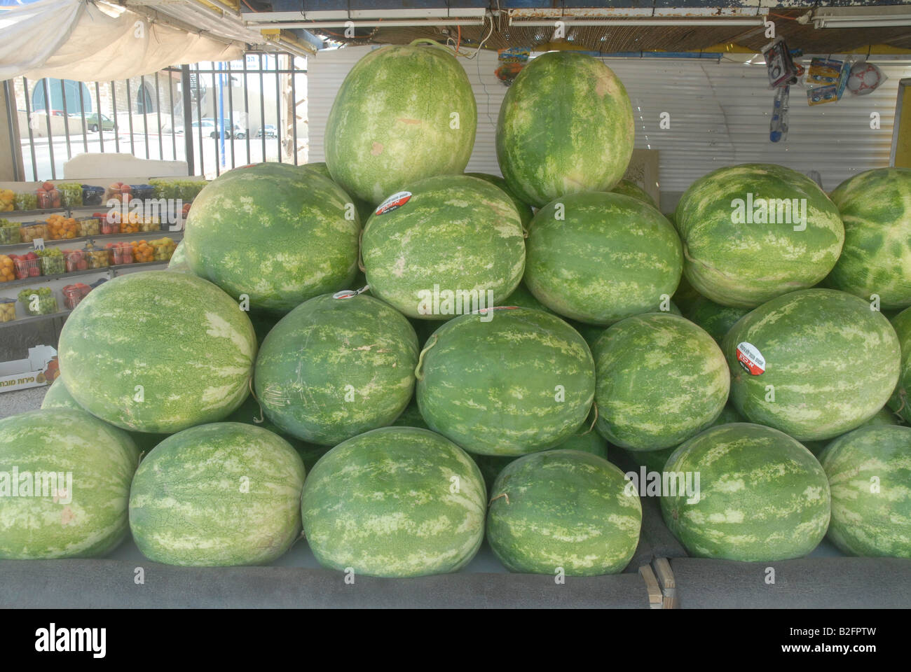 Stall selling fresh watermelons a stack of watermelons on display Stock ...