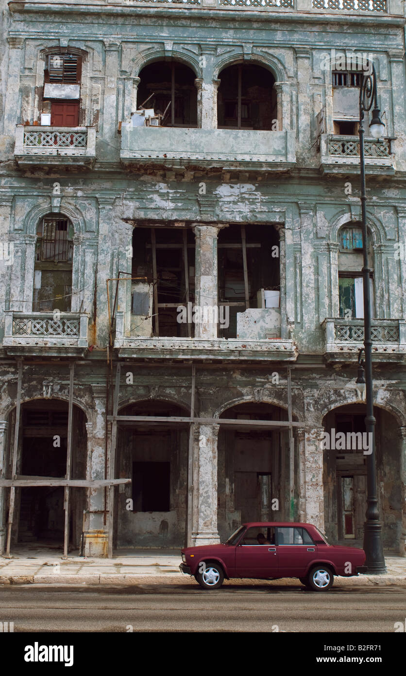 classic car sits outside run down buliding in old town havana Stock ...