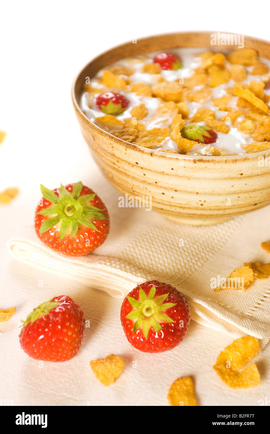 Healthy morning breakfast Bowl full of milk and cornflakes and fresh ...