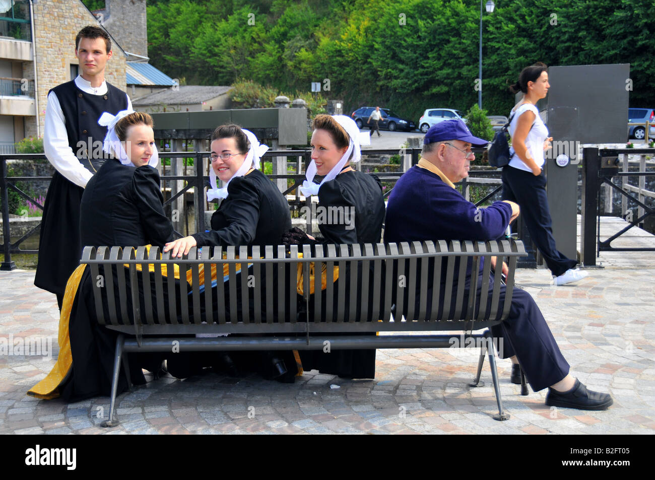 breton people seat down a bench during the Cornwall Festival in Quimper ...