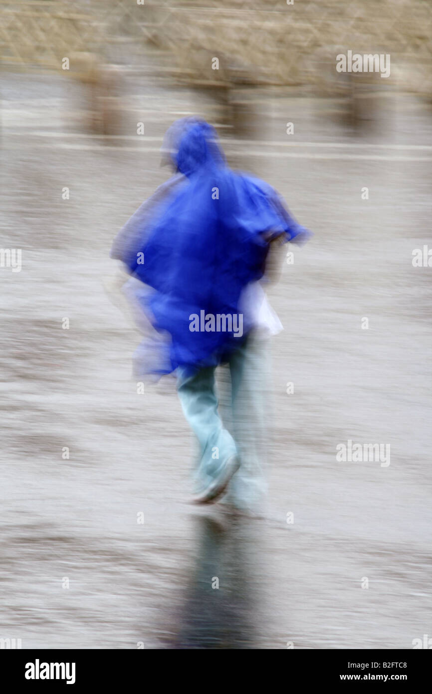 person wearing waterproof coat cape in rain Stock Photo - Alamy