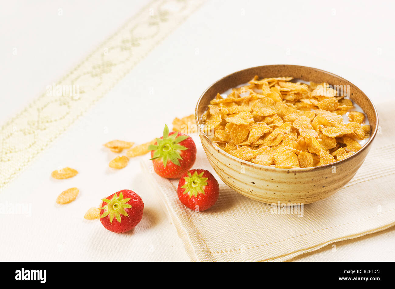Healthy morning breakfast Bowl full of milk and cornflakes with fresh ...