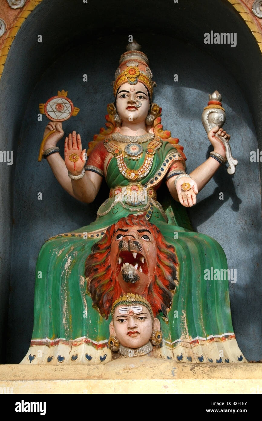 Statue above a temple of the Hindu Goddess Durga and her vehicle Lion ...